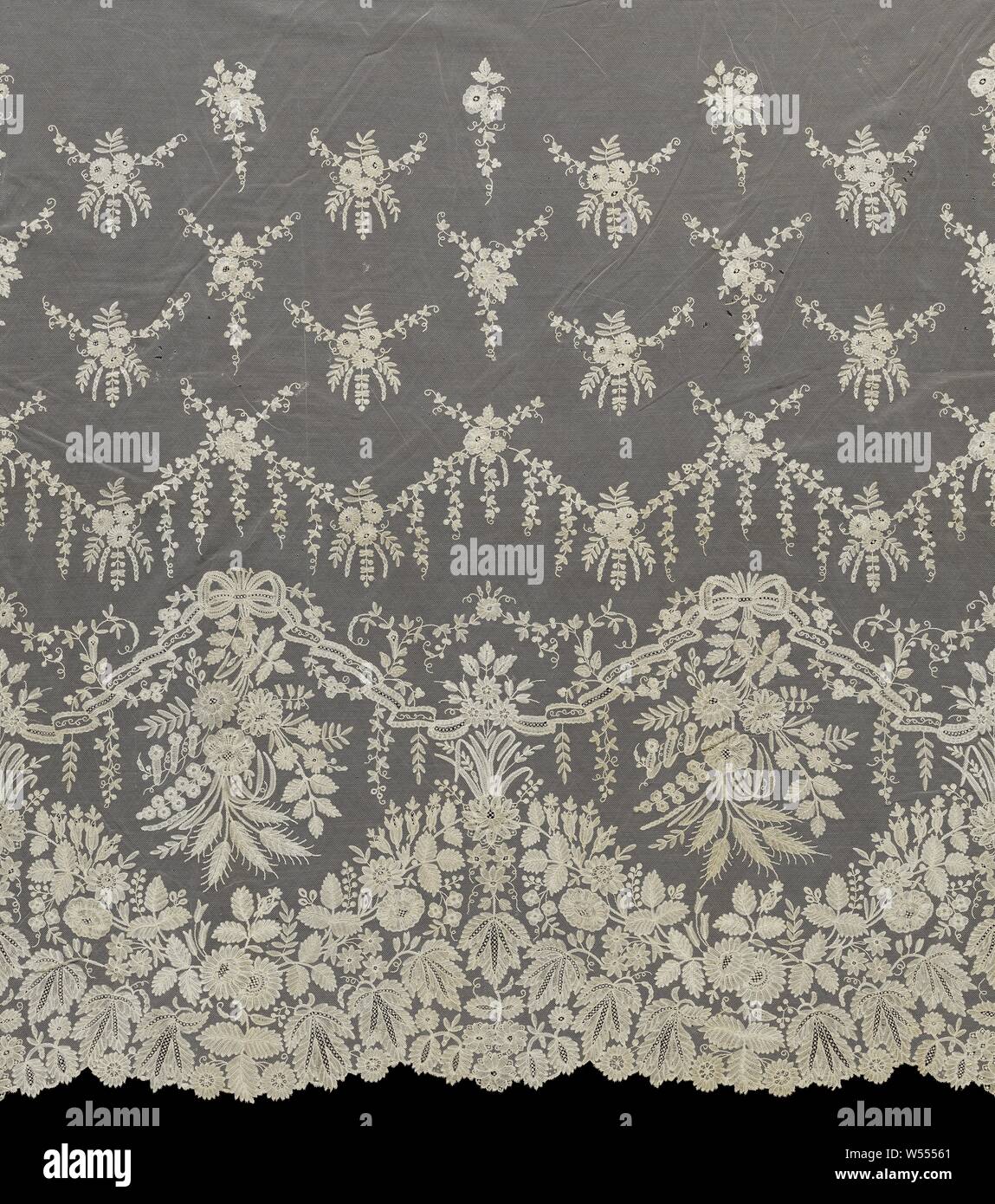 Overcoat of a bridal gown from application side with bouquets of ...
