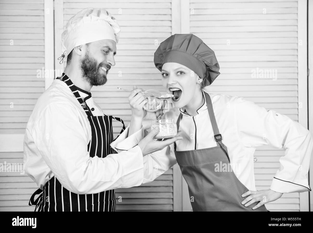 Happy married couple have joy together at kitchen. secret ingredient by ...