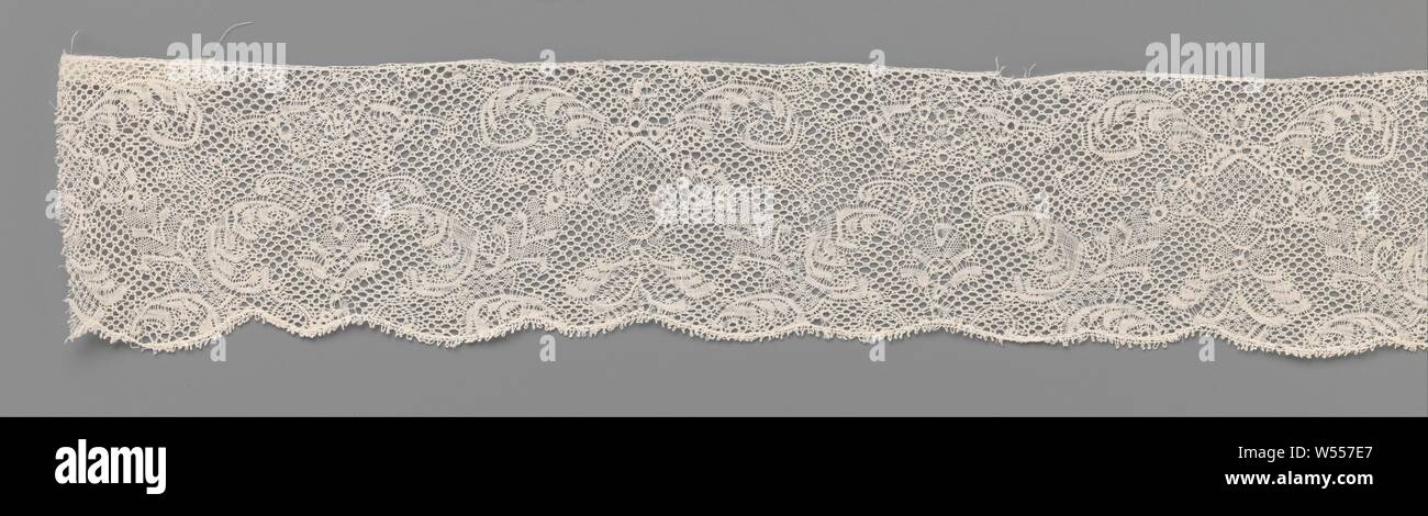 Strip of bobbin lace with two triangular compositions placed against ...