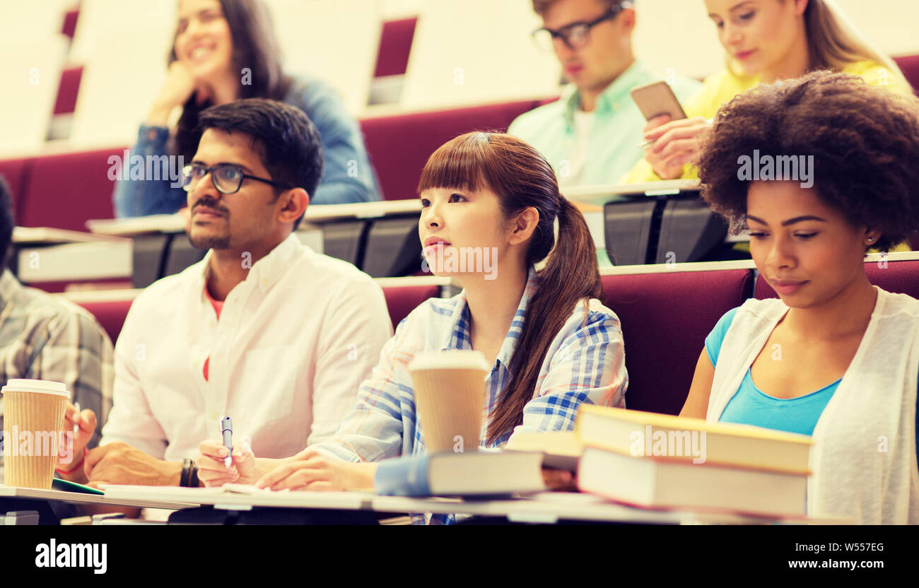 group of students with notebooks on lecture Stock Photo - Alamy