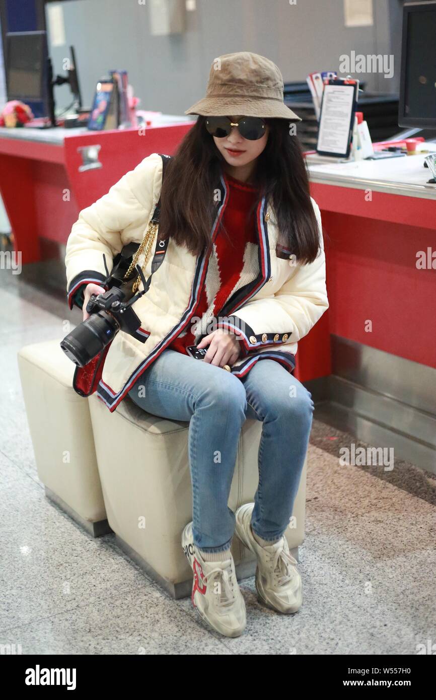 Chinese actress Ni Ni arrives at the Beijing Capital International ...