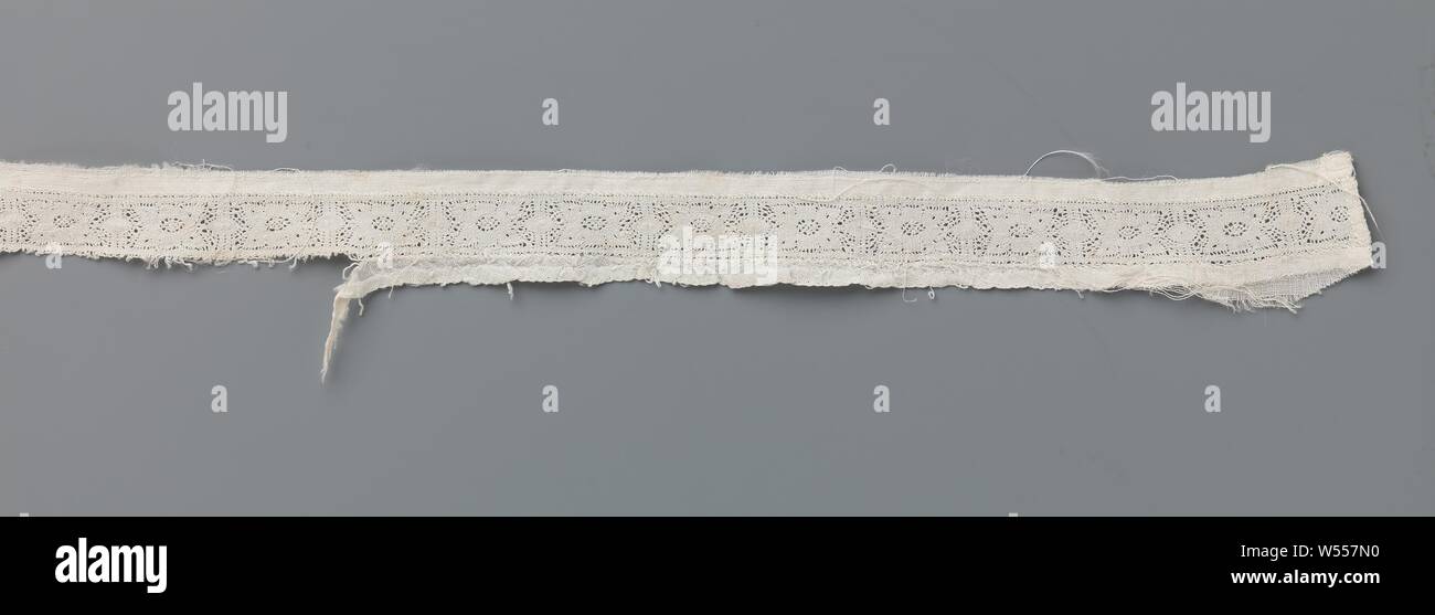 Strip of bobbin lace with stylized flower between two vertical lines ...