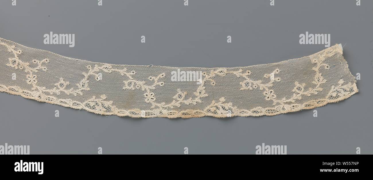 Strip of bobbin lace with continuous wavy tendril with berries and ...