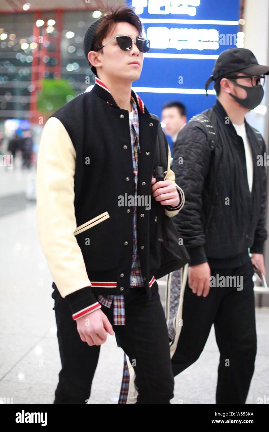 Chinese actor Wu Lei arrives at the Beijing Capital International ...