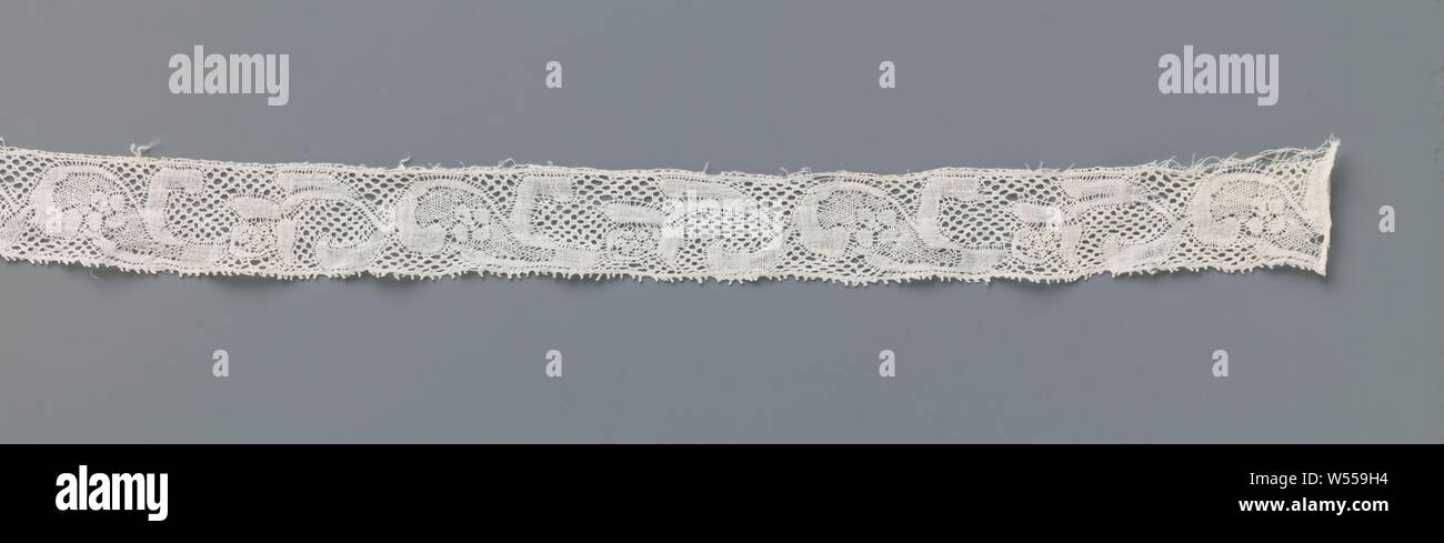 Strip of bobbin lace with a flower stem alternated by a drop-shaped ...