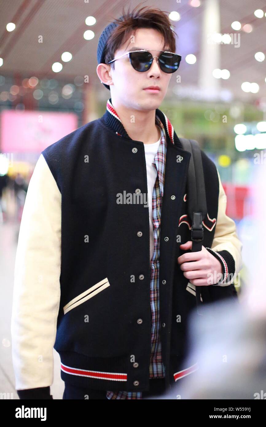 Chinese actor Wu Lei arrives at the Beijing Capital International ...