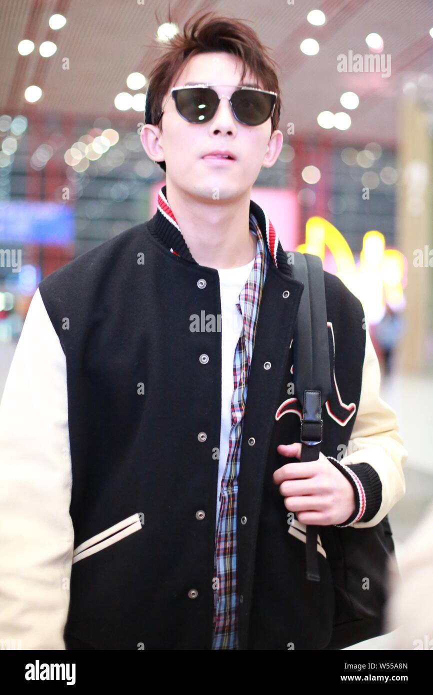 Chinese actor Wu Lei arrives at the Beijing Capital International ...