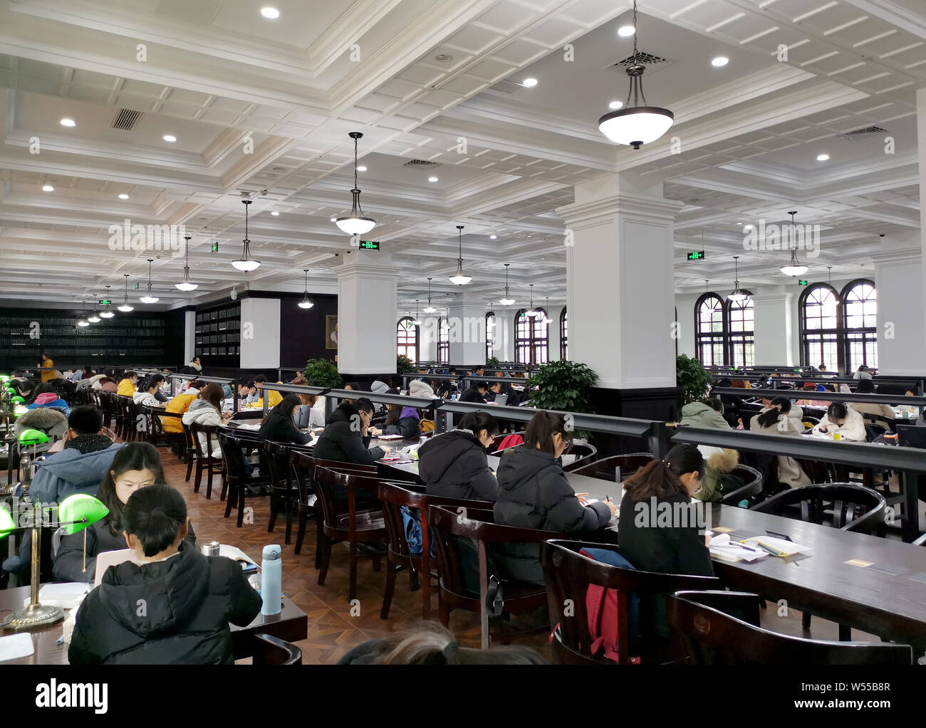 Students study in a reading room, decorated in a neoclassical style, in ...