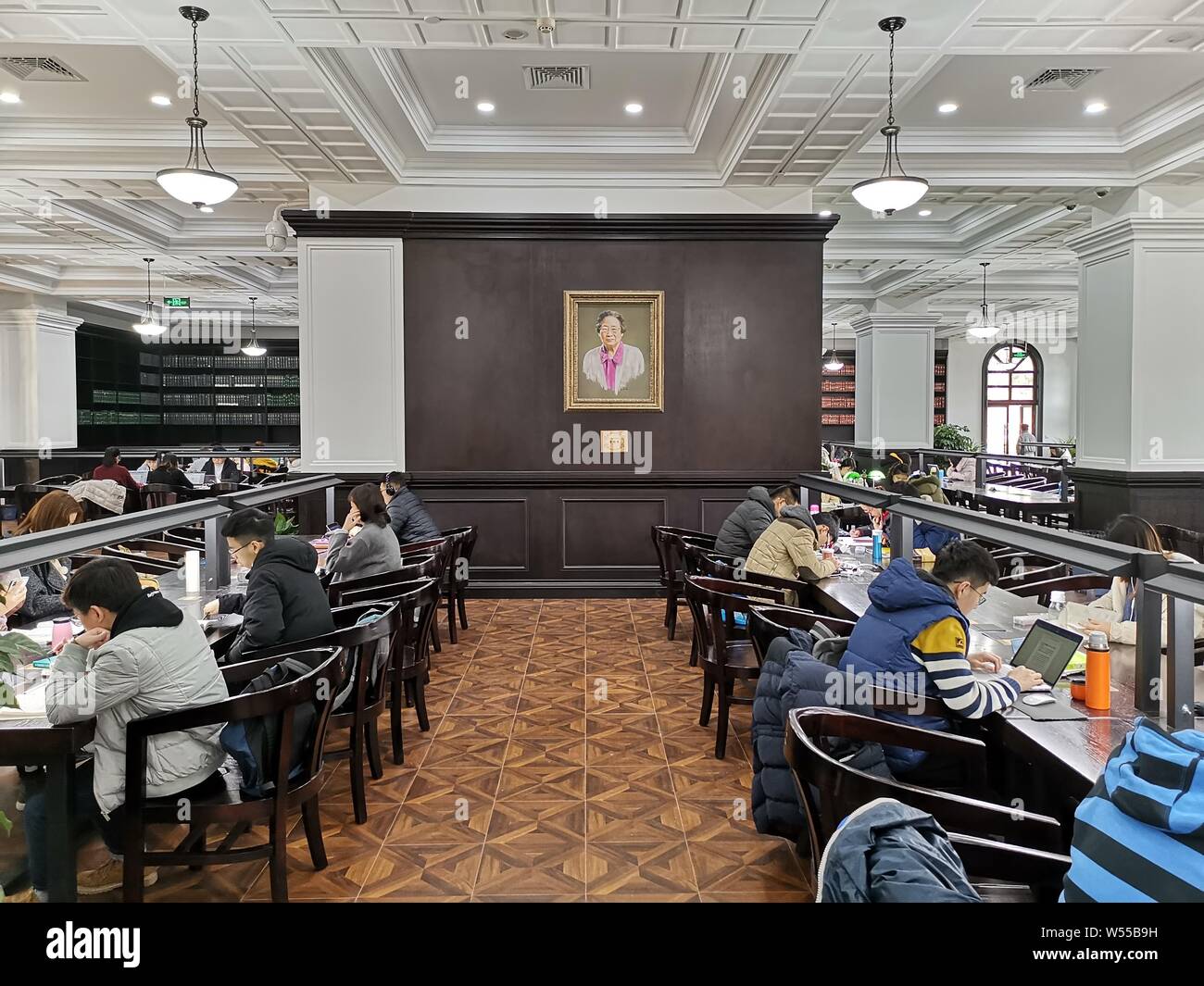 Students study in a reading room, decorated in a neoclassical style, in ...