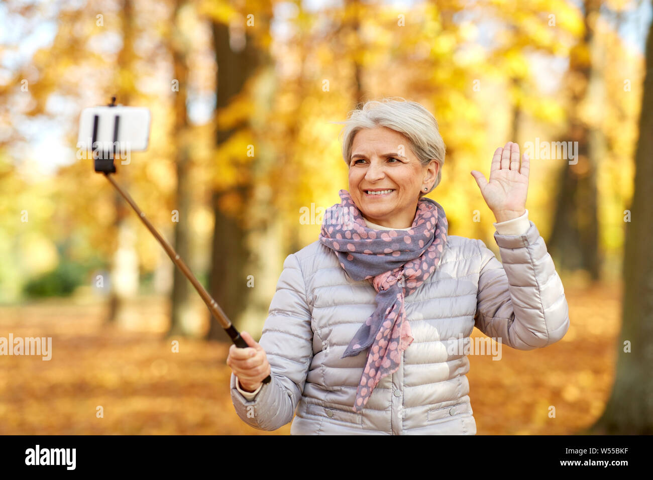 Mature woman taking greeting hi-res stock photography and images - Alamy