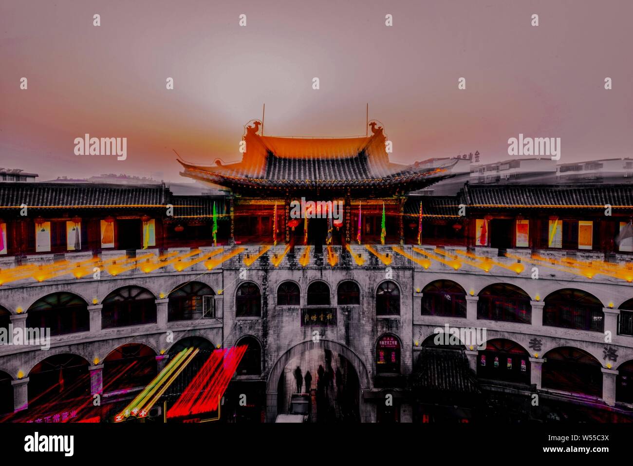 The Lijing Gate, known as the East Gate, is illuminated by colorful ...