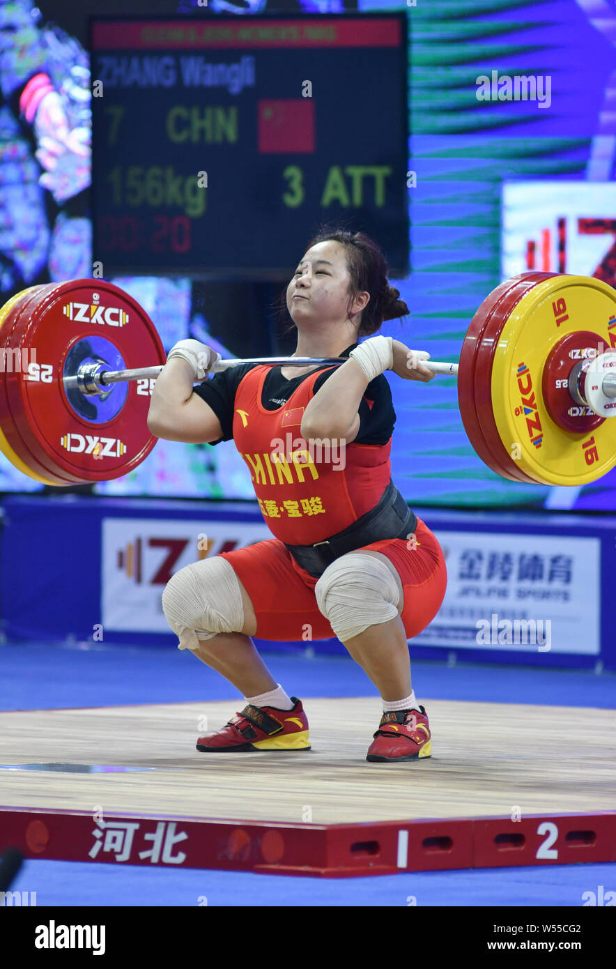 China's Zhang Wangli competes in the women's 76kg division during the ...