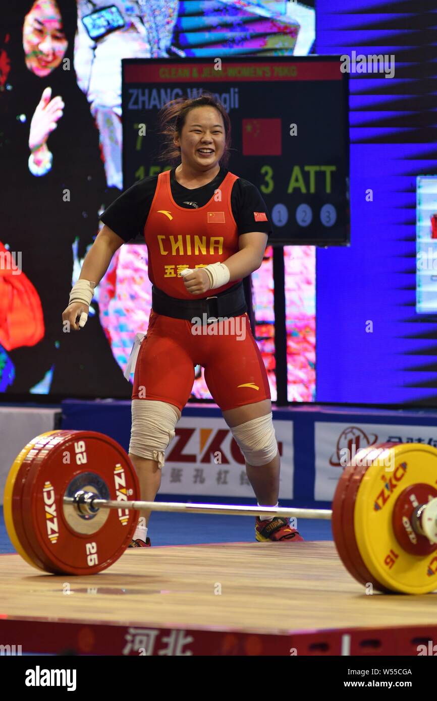 China's Zhang Wangli reacts after breaking a world record in the women ...