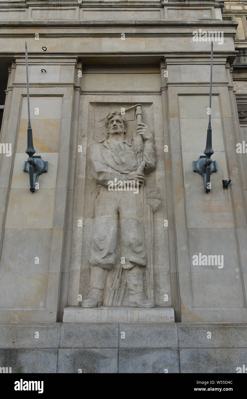 Bas relief of workers at Constitution square Stock Photo - Alamy