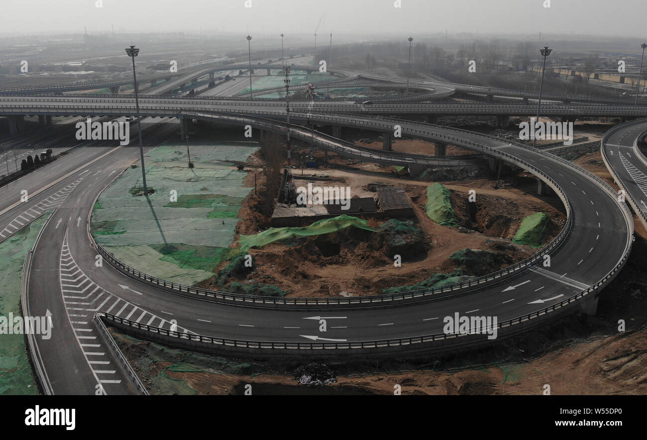 An aerial view of the nail house, which stands in the middle of circled ...
