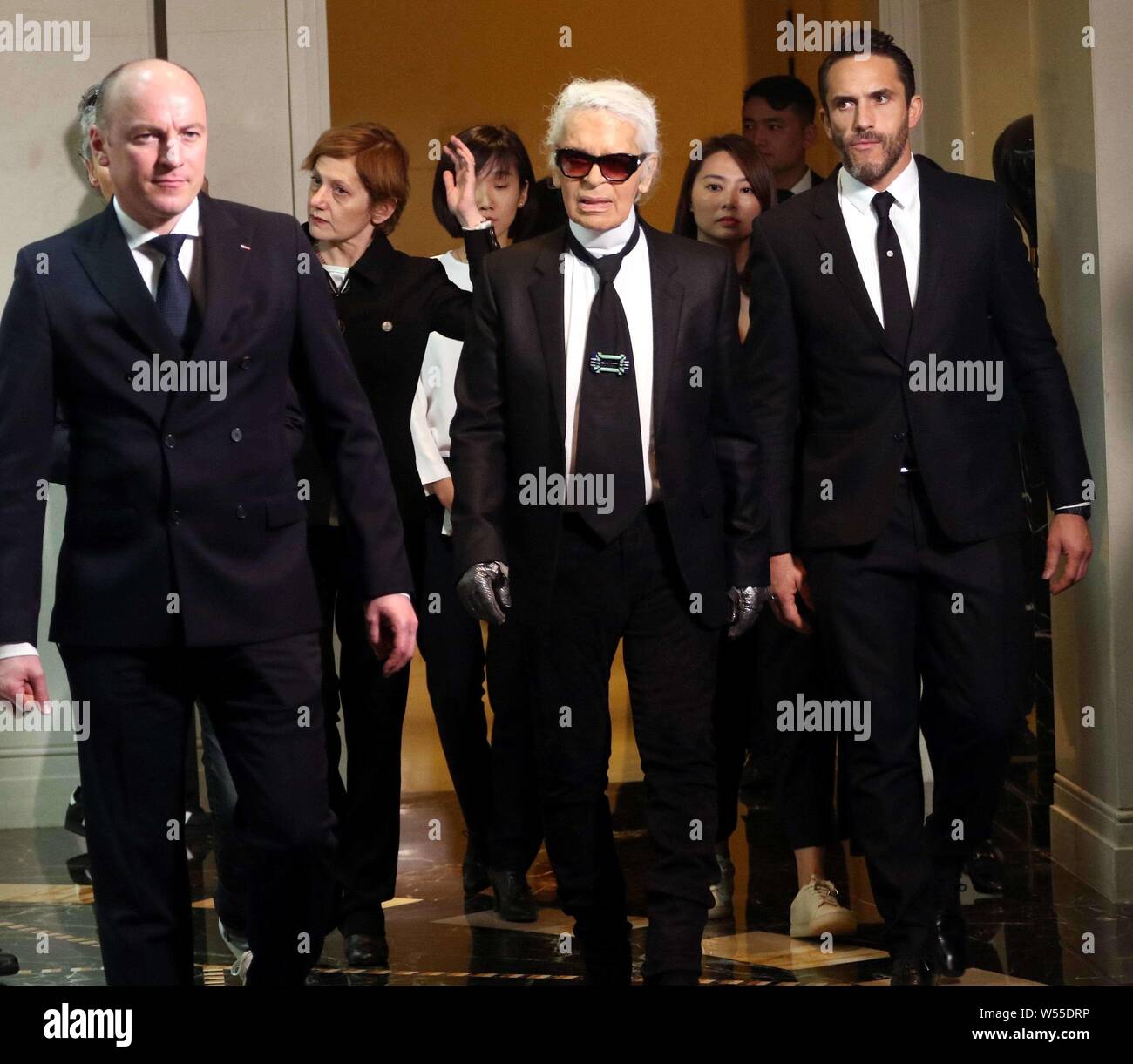 --FILE--German fashion designer Karl Lagerfeld, center, attends the ...