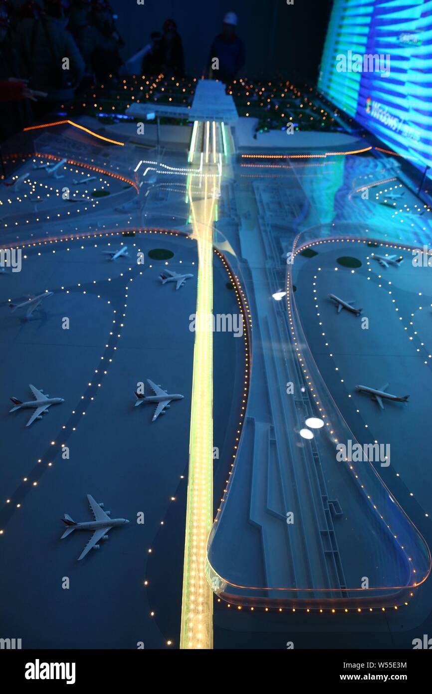 People visit the Beijing Daxing International Airport Station under ...