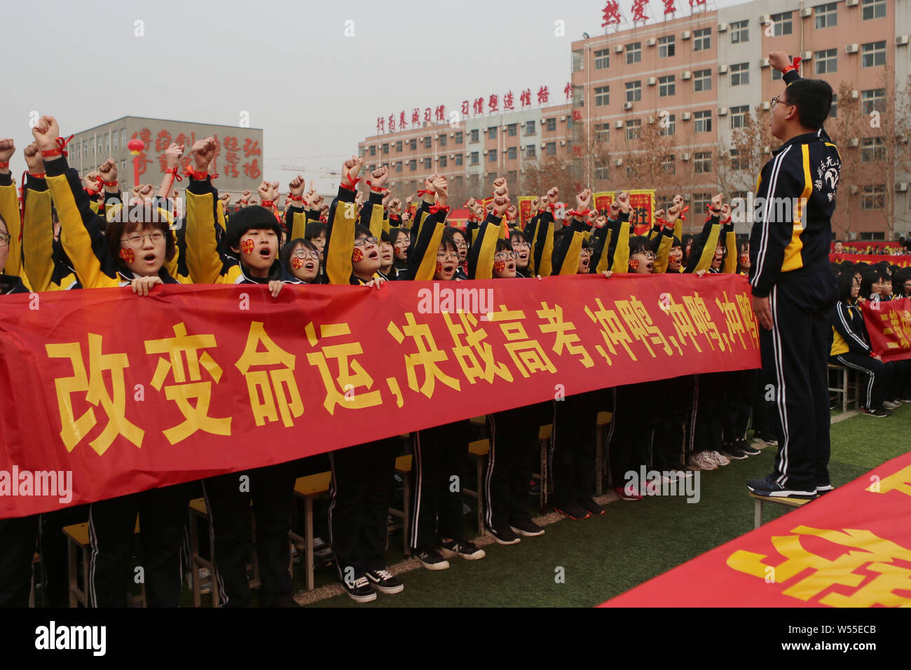 Chinese students queue up in lines during a mass rally for the upcoming ...