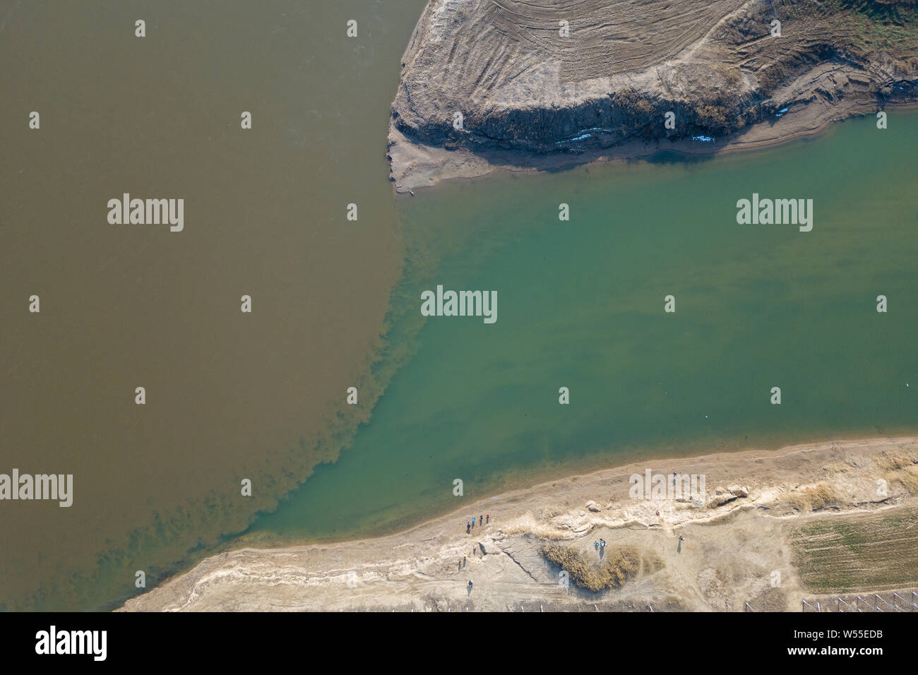 The clean Jing River meets the sandy Wei River in Xi'an city, northwest China's Shaanxi province ...