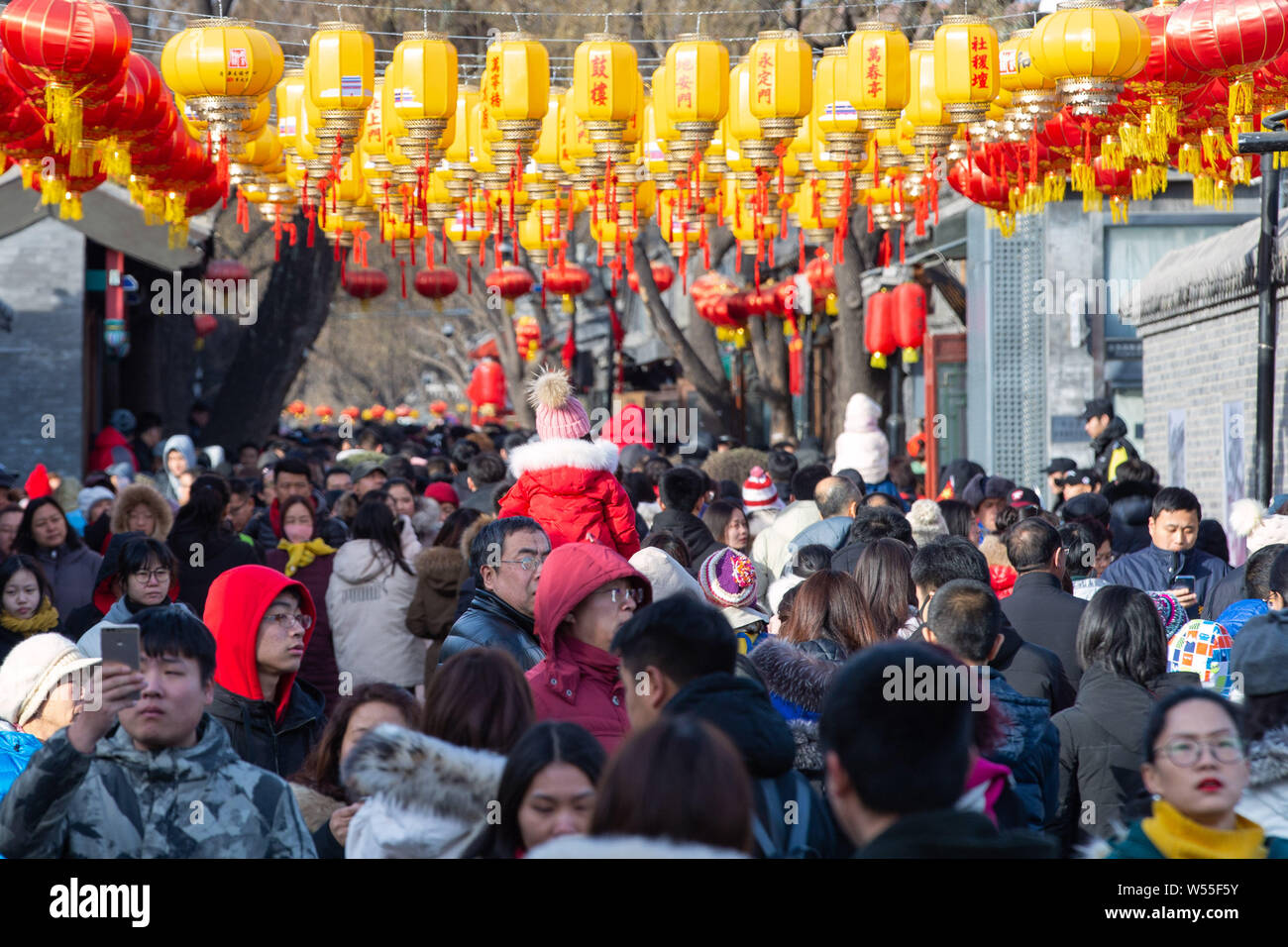 Tourists crowd the Nanluoguxiang alley during the Chinese Lunar New ...