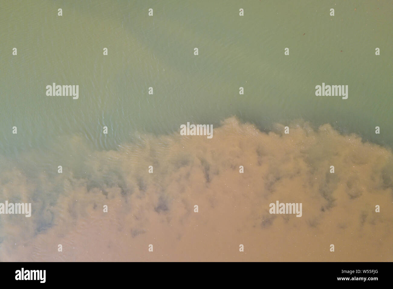 The clean Jing River meets the sandy Wei River in Xi'an city, northwest China's Shaanxi province ...