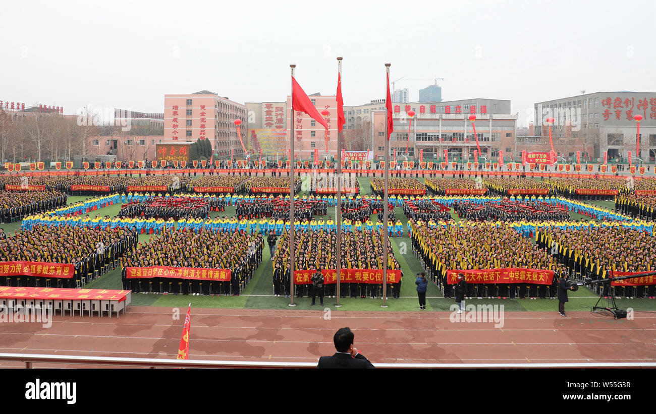 Chinese students queue up in lines during a mass rally for the upcoming ...