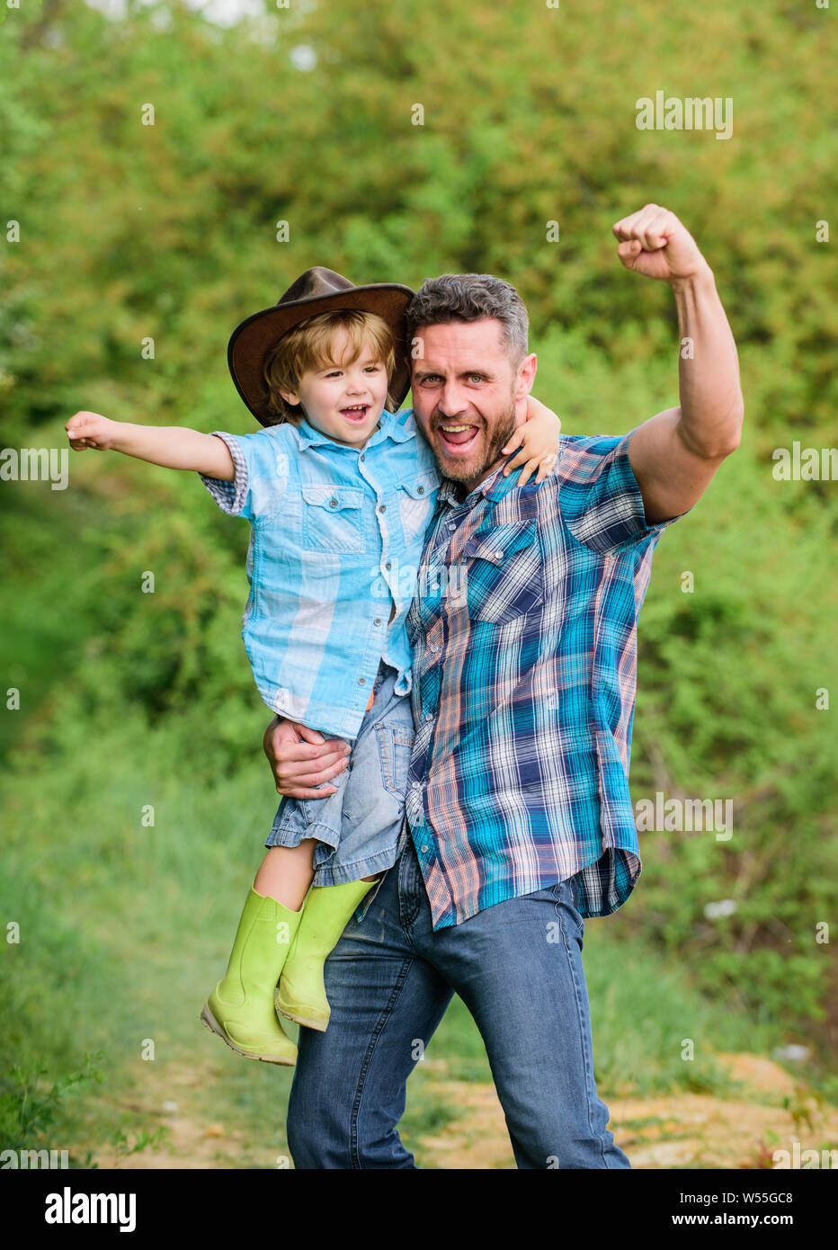 Power being father. Child having fun cowboy dad. Rustic family. Growing ...