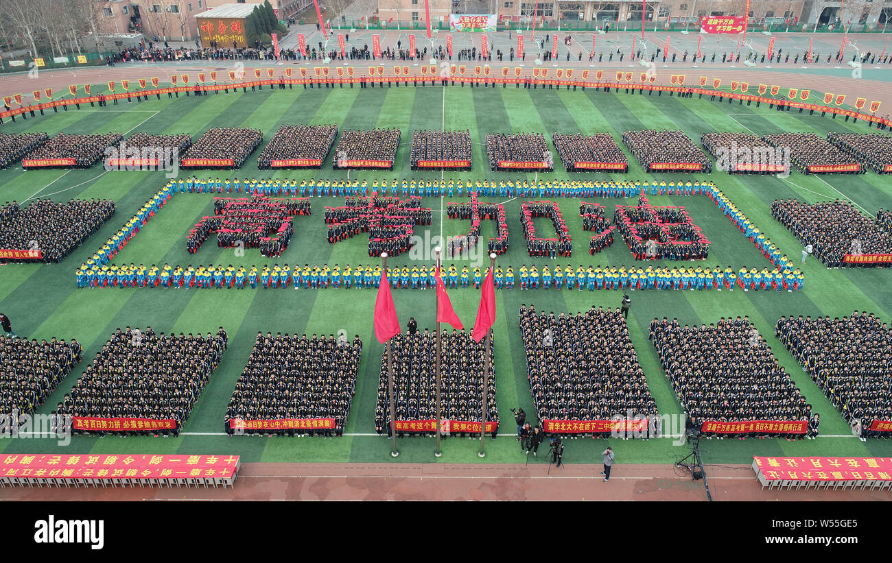 Chinese students queue up in lines during a mass rally for the upcoming ...