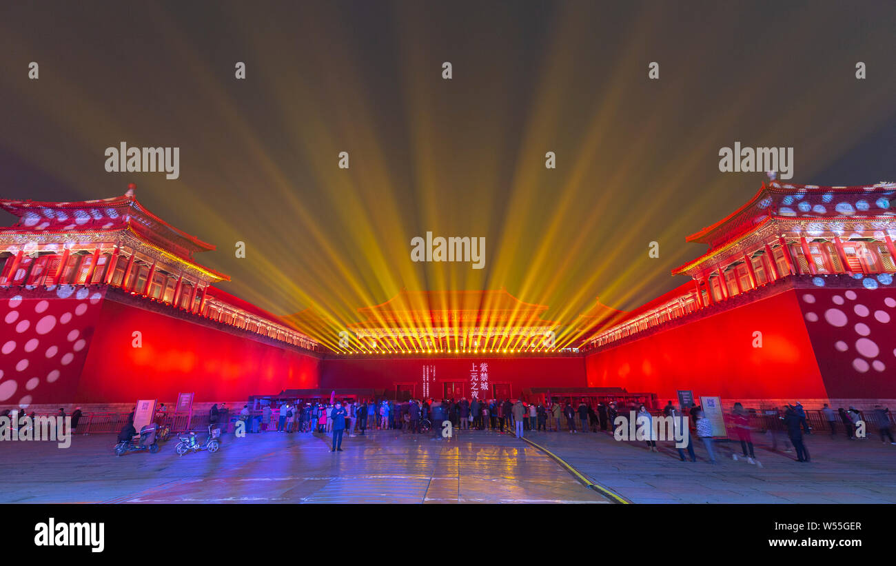 The Palace Museum, also known as the Forbidden City, is illuminated by colorful lights for a ...