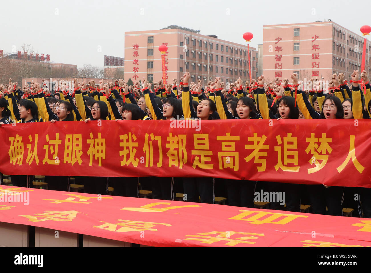 Chinese students queue up in lines during a mass rally for the upcoming ...