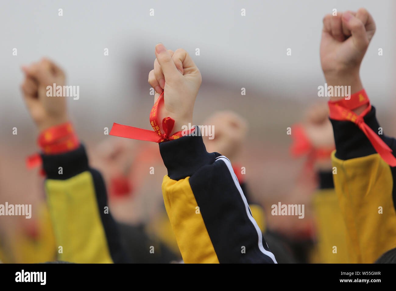 Chinese students queue up in lines during a mass rally for the upcoming ...