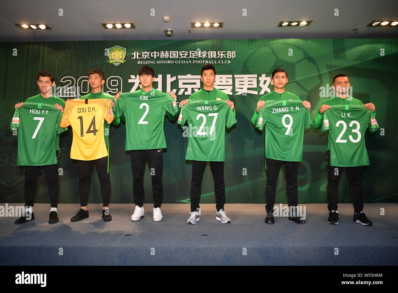 (From left) Hou Yongyong, Zou Dehai, South Korean football player Kim ...