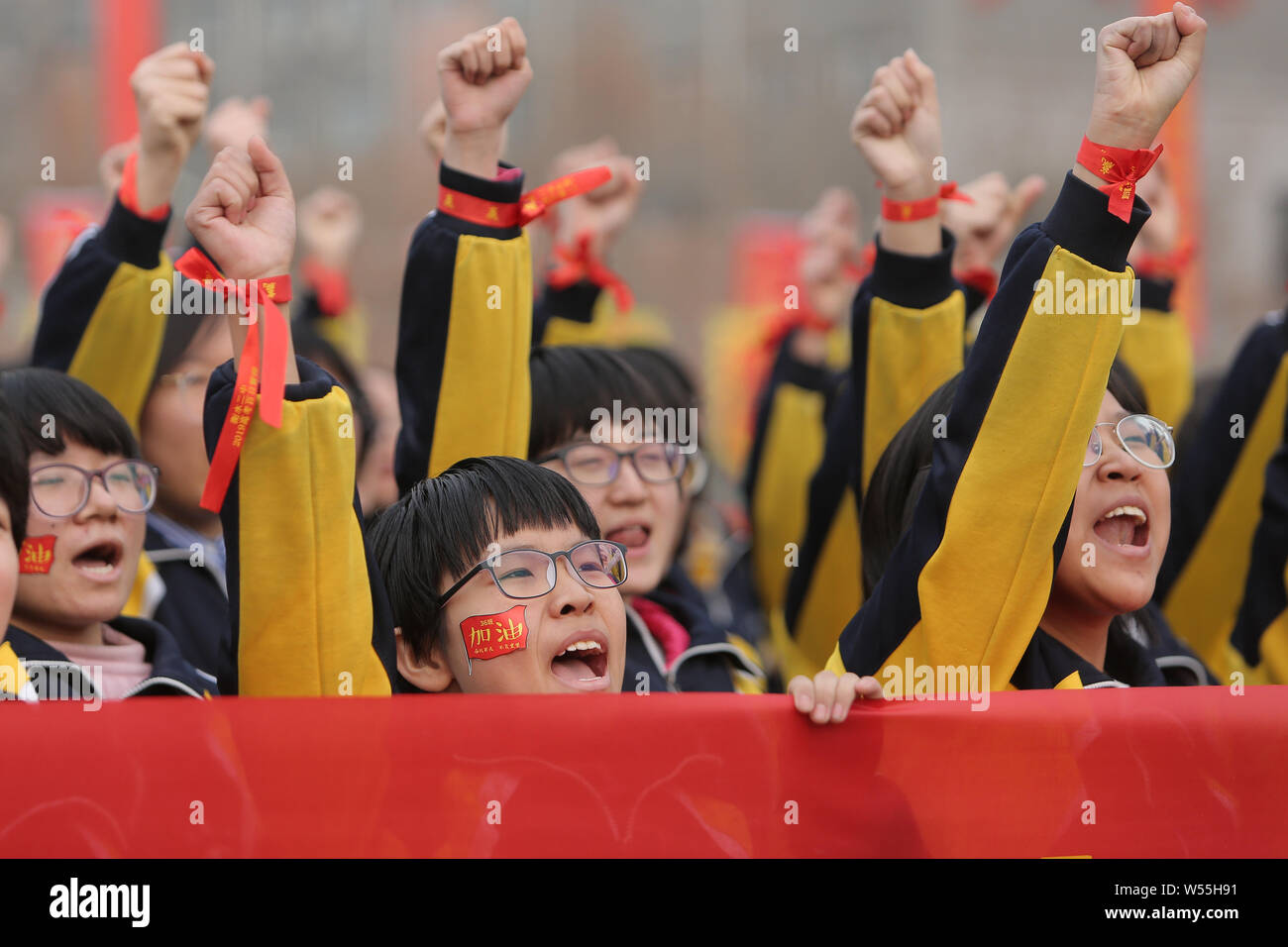 Chinese students queue up in lines during a mass rally for the upcoming ...