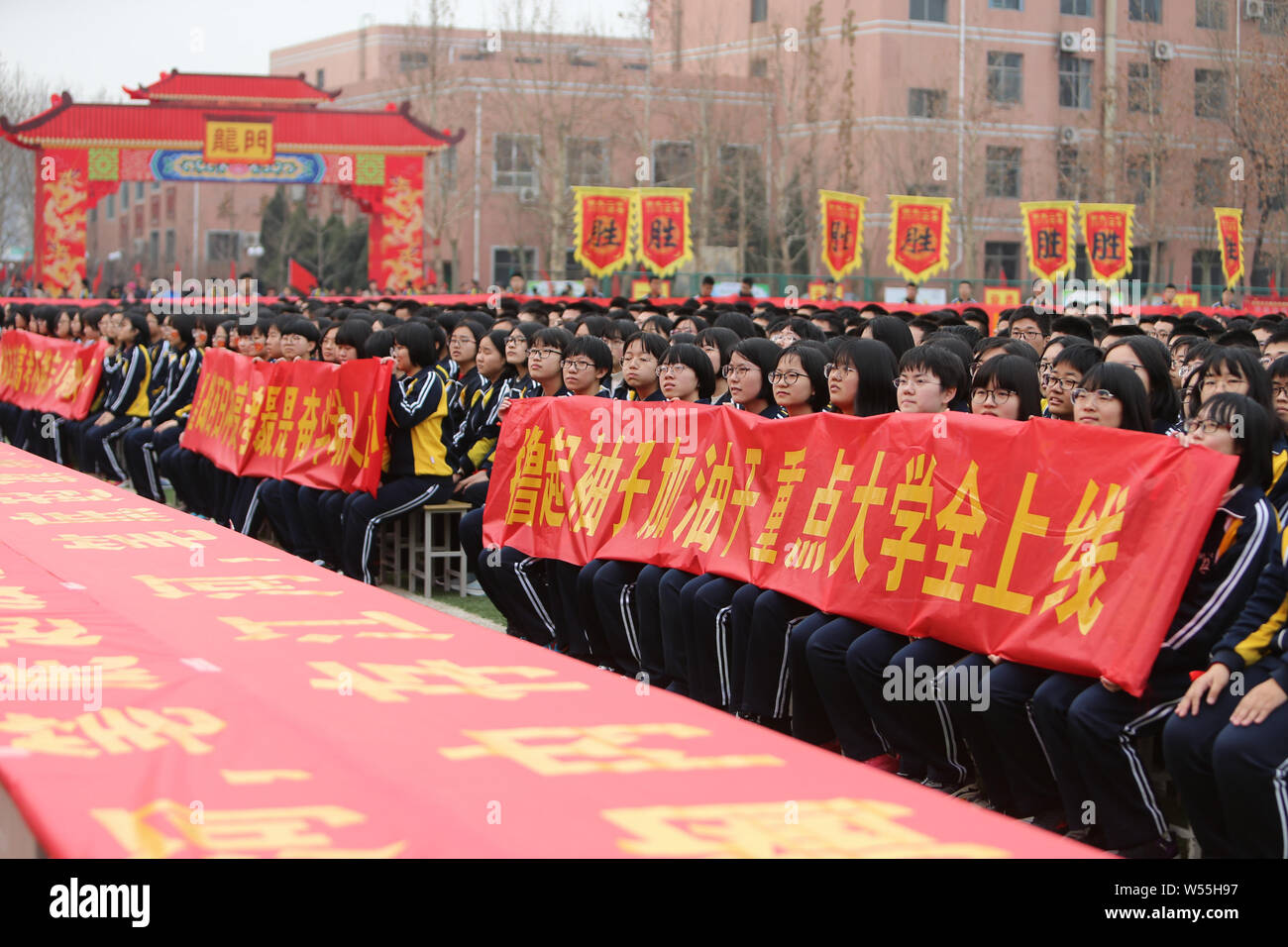 Chinese students queue up in lines during a mass rally for the upcoming ...