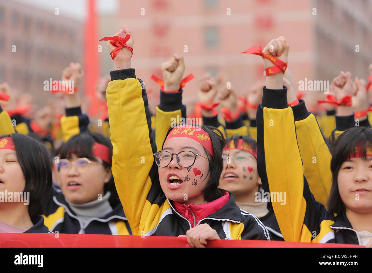 Chinese students queue up in lines during a mass rally for the upcoming ...