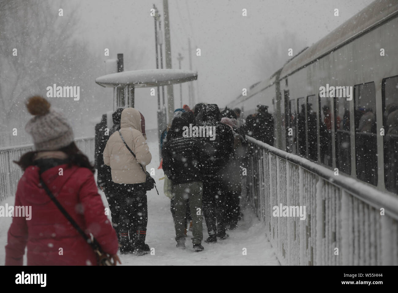 Chinese tourists take a S2 Maglev subway train to visit the Badaling ...