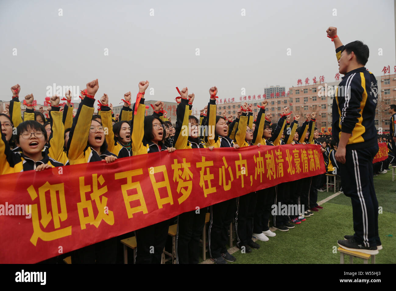 Chinese students queue up in lines during a mass rally for the upcoming ...