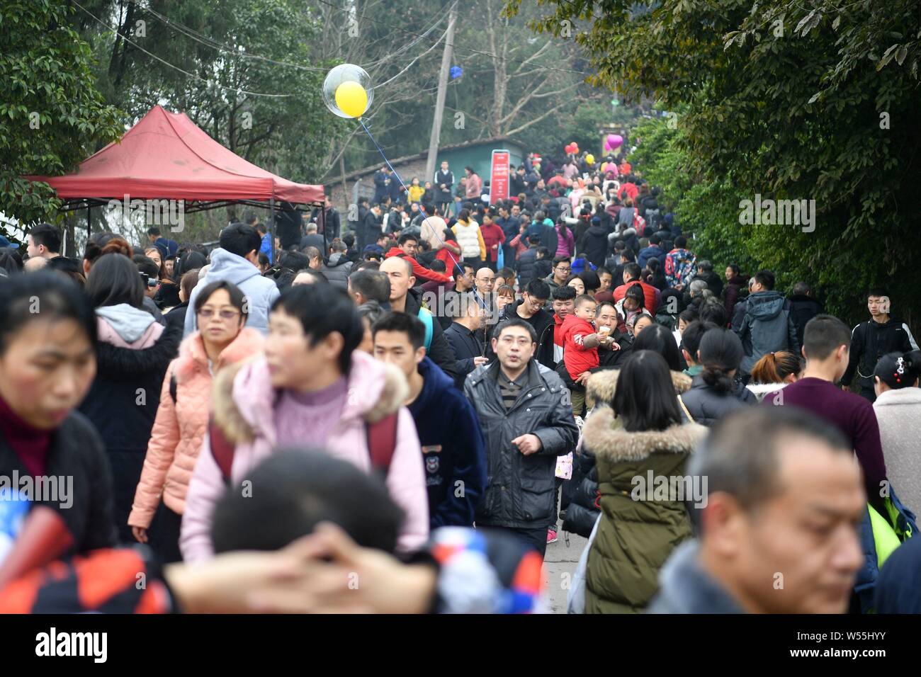 Local residents crowd the Fenghuang mountain during the Dazhou Yuanjiu ...