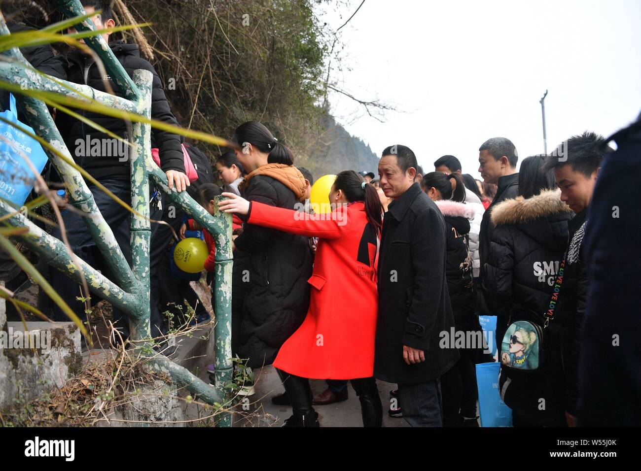 Local residents crowd the Fenghuang mountain during the Dazhou Yuanjiu ...