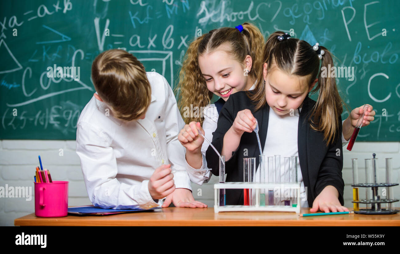 Happy children. Chemistry lesson. Little kids learning chemistry ...
