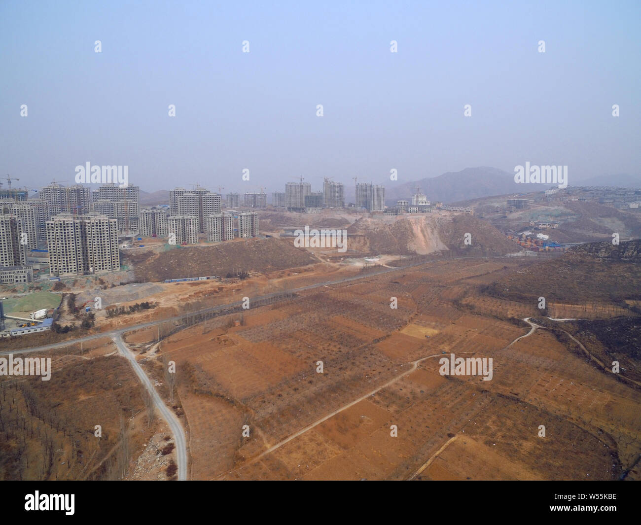 An aerial view of the mountain land and villas under construction in ...