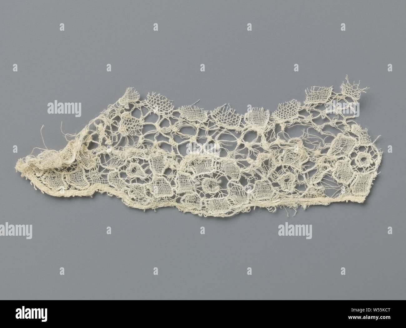 Strip of bobbin lace with a pearl and rosette frame, On the lattice ...