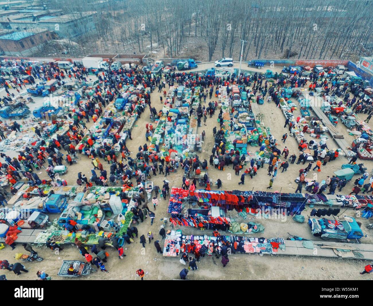 An aerial view of local residents shopping for groceries and delicacies ...