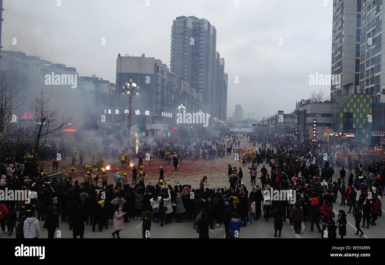 Local Chinese people conduct firecracker dragon performance to ...