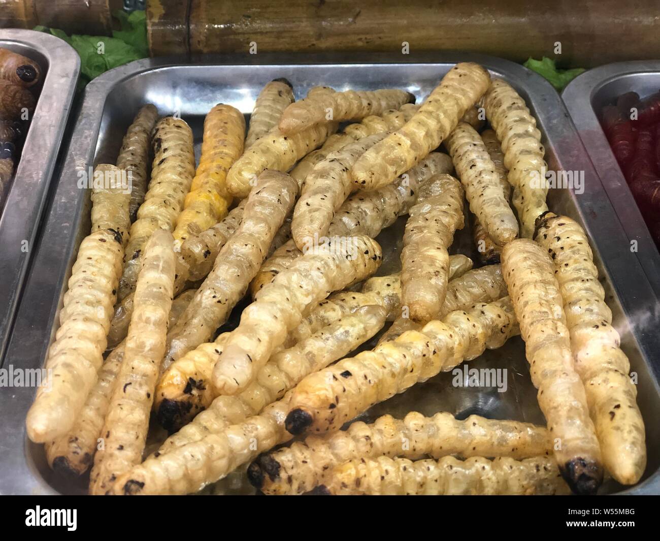 Deep fried insects are for sale at a food market in Kunming city ...