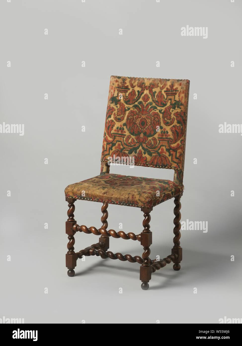 Chair with swivel legs, covered with string with a pattern of red and ...