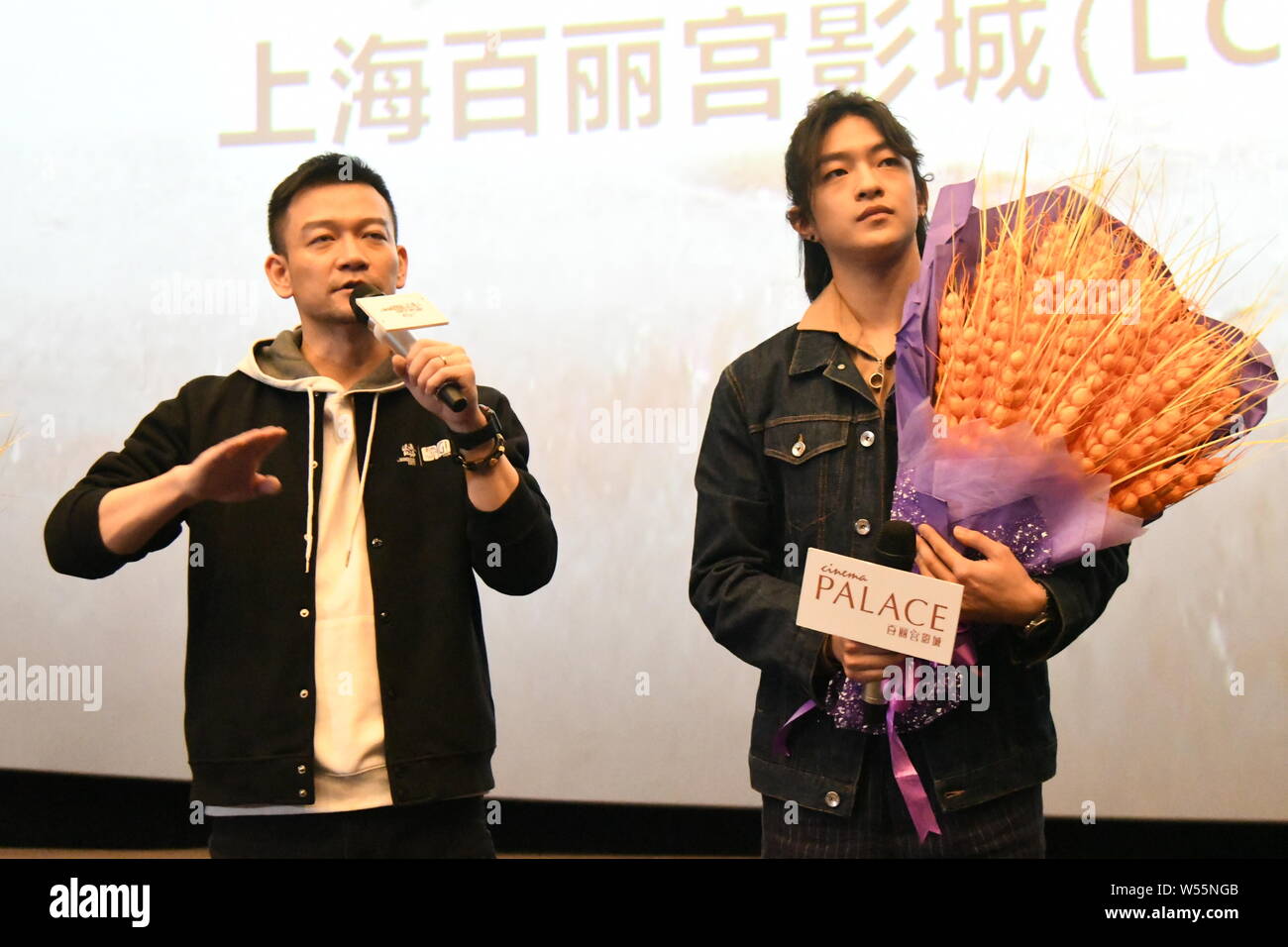 Chinese director Guo Fan, left, and actor Qu Chuxiao attend a fan ...