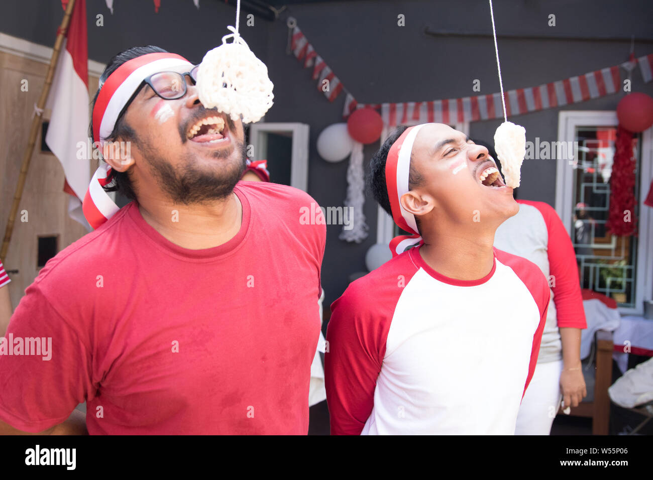 indonesia crackers eating competition Stock Photo - Alamy indonesia crackers eating competition Stock Photo - Alamy