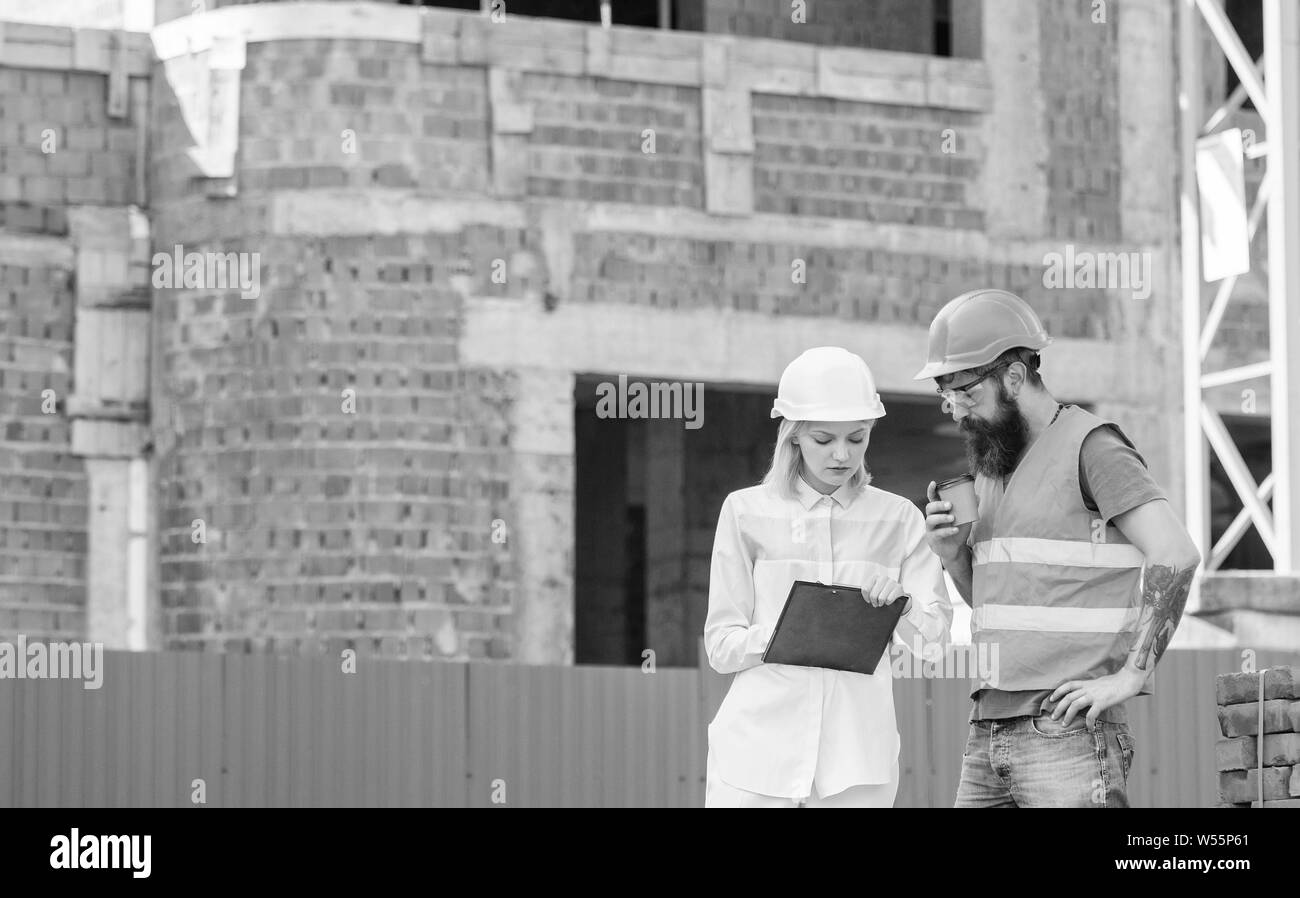 Construction team communication concept. Woman engineer and builder ...