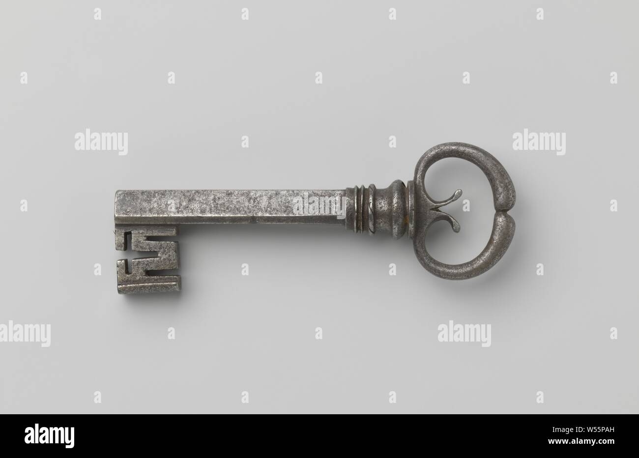 Key, Drilled key with the eye formed from two facing C-volutes, ending ...
